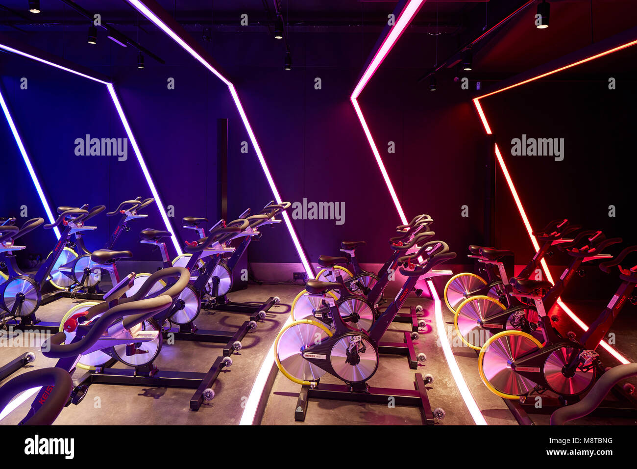Cycle studio with strip lighting. KXU London, London, United Kingdom ...