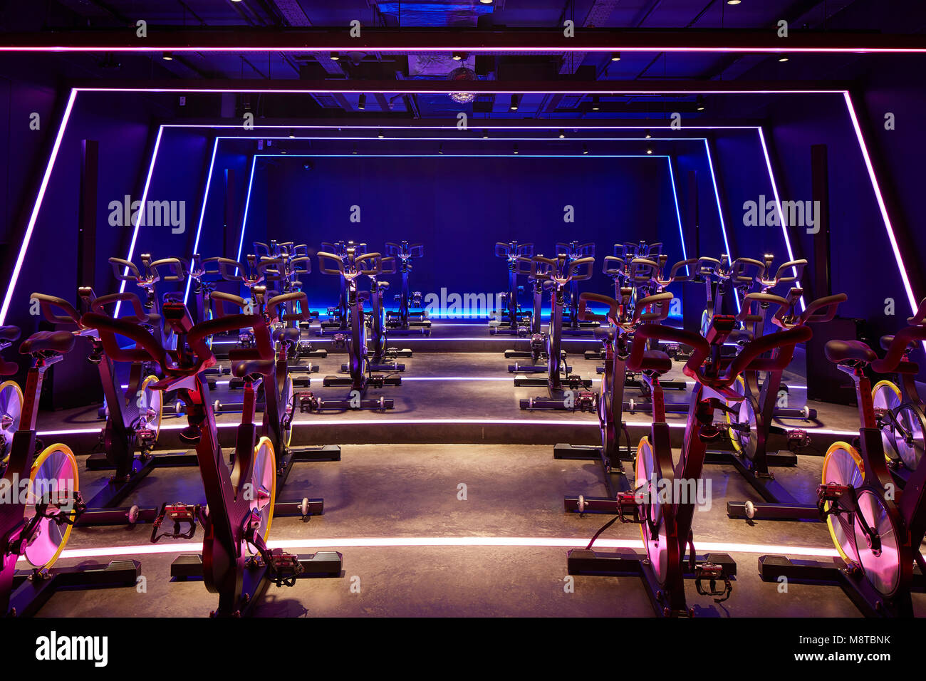 Cycle studio with strip lighting. KXU London, London, United Kingdom ...