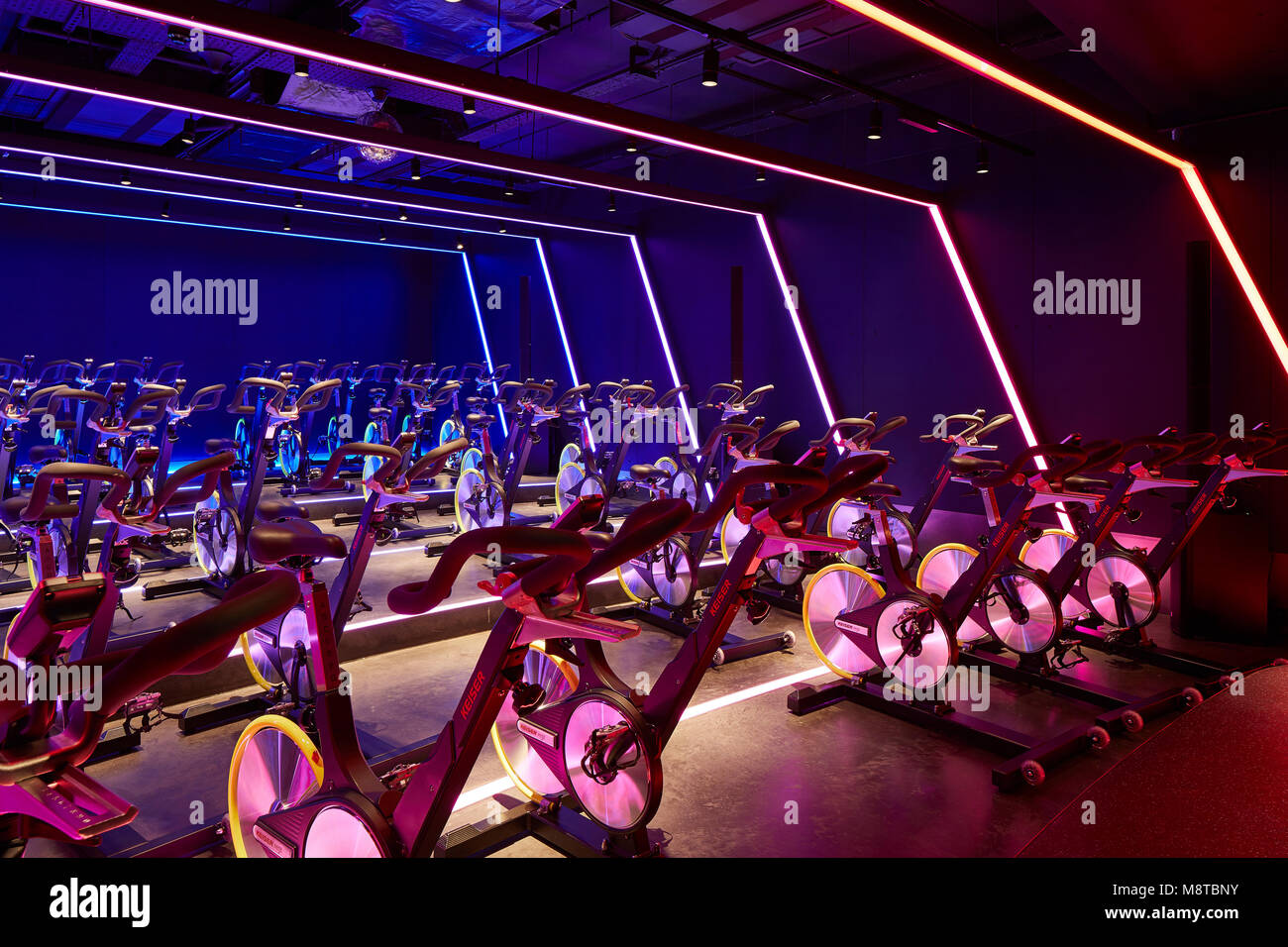 Cycle studio with strip lighting. KXU London, London, United Kingdom ...