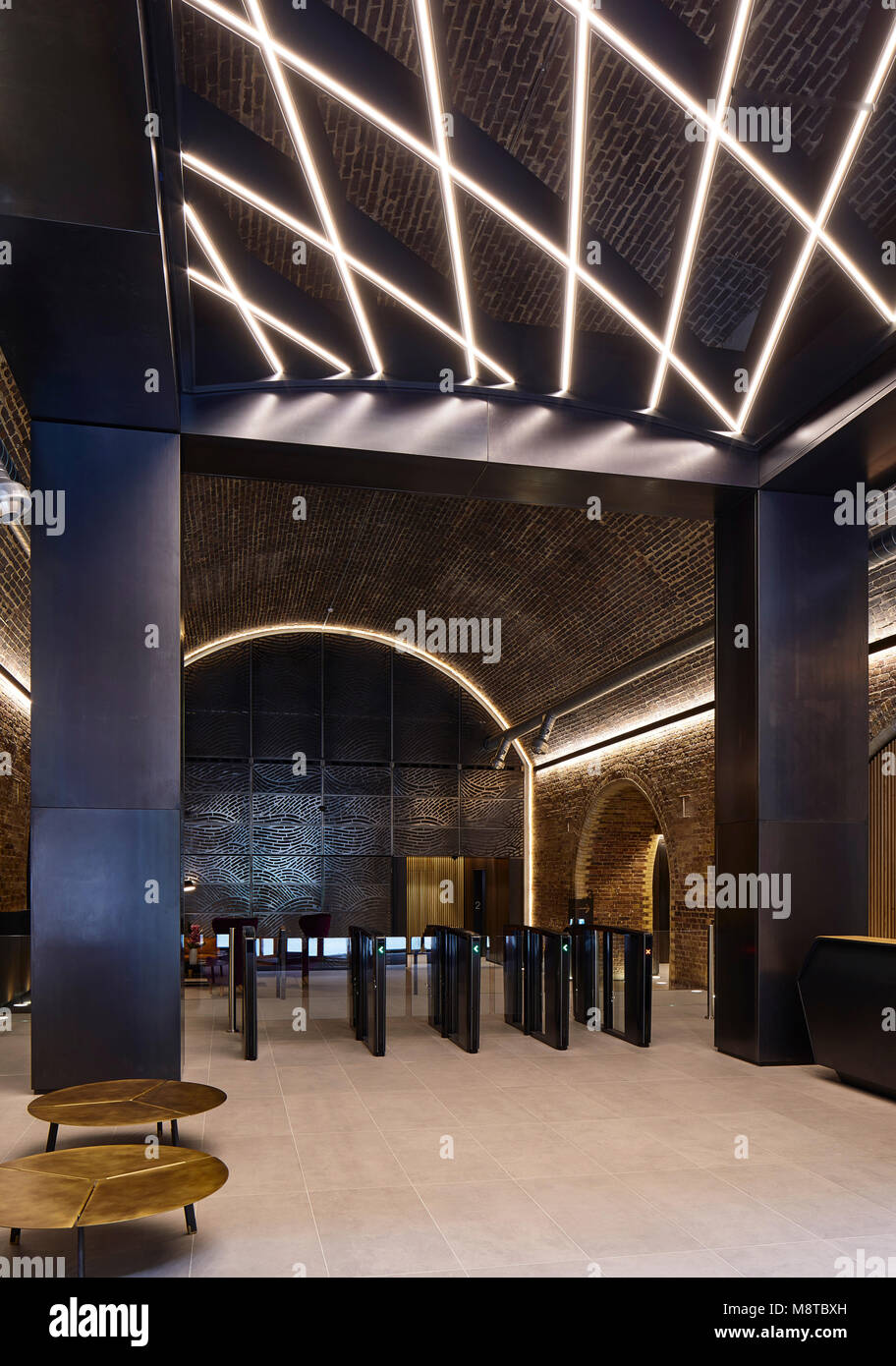 Security turnstiles in reception area. The River Building, London ...