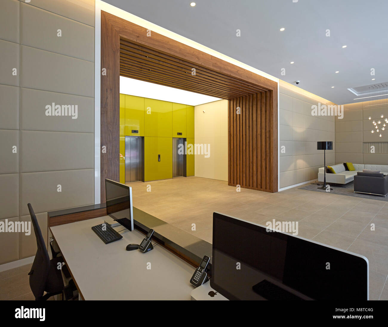 Reception area with view through to elevators and seating area. One ...