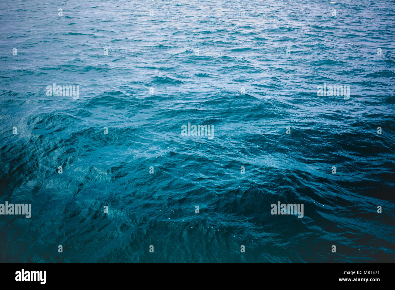 Blue sea surface, top view. Dark mood tone Stock Photo - Alamy