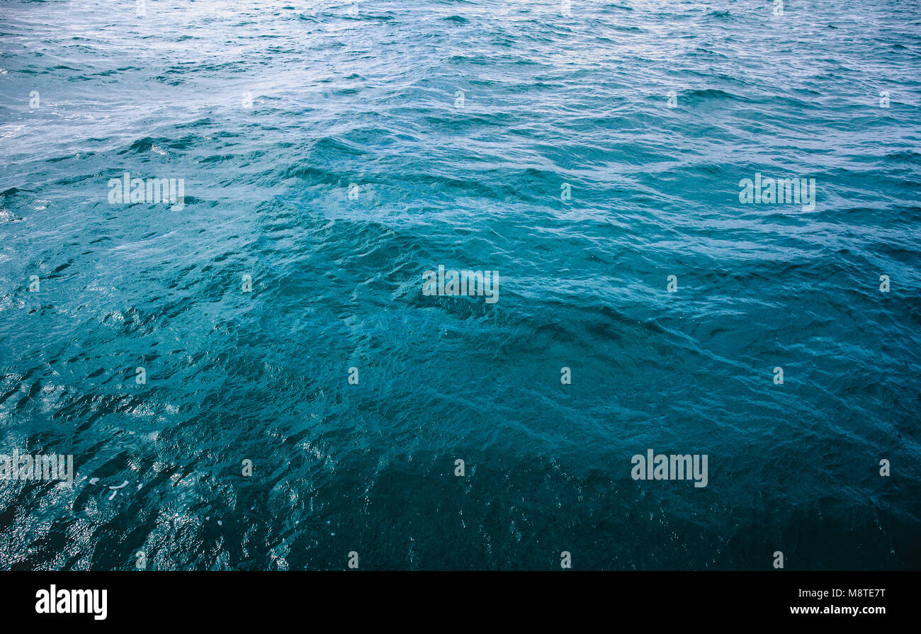 Blue sea surface, top view. Dark mood tone Stock Photo - Alamy