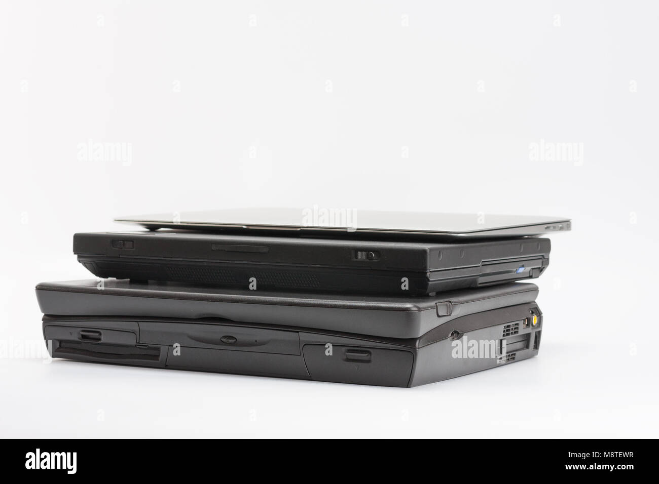 Comparing of laptops, new modern and old laptops, present and past ...