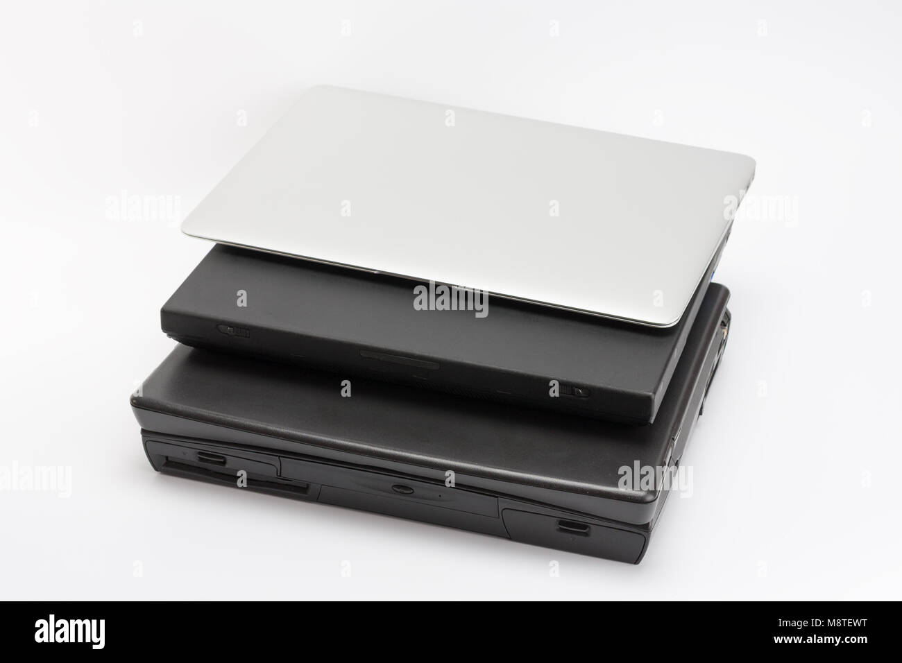 Comparing of laptops, new modern and old laptops, present and past ...