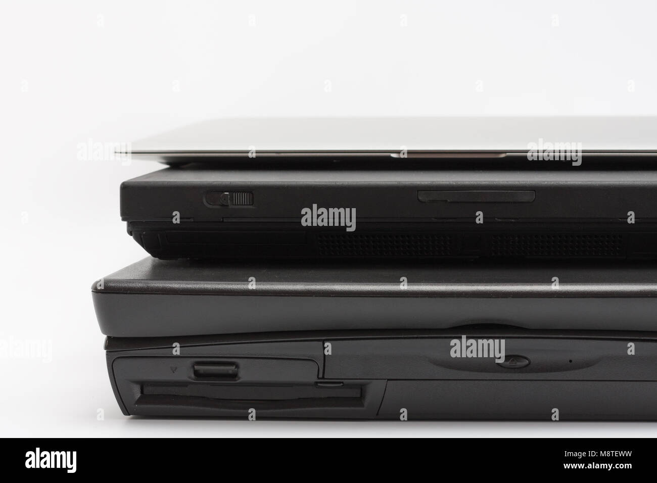 Comparing of laptops, new modern and old laptops, present and past ...