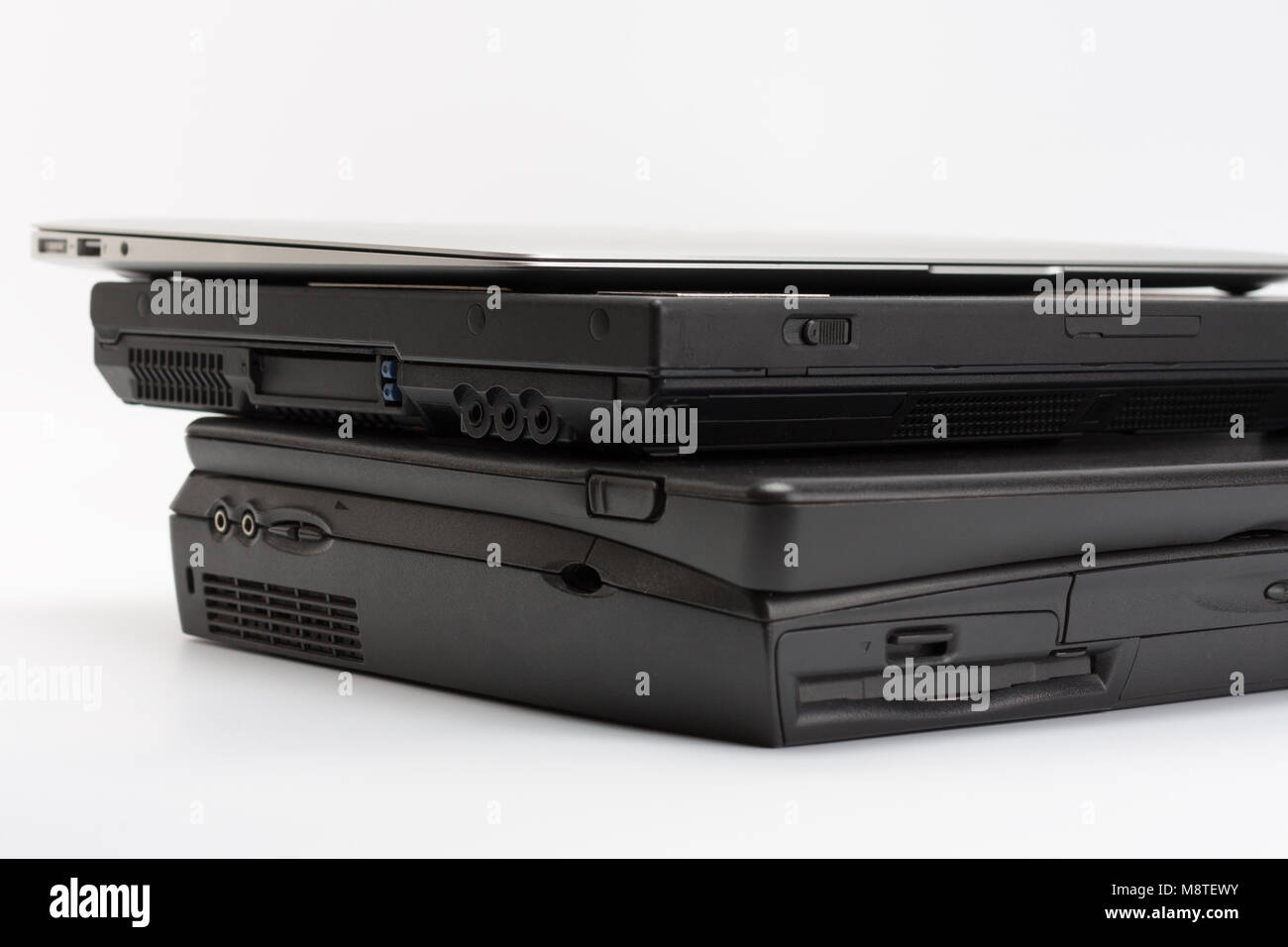 Comparing of laptops, new modern and old laptops, present and past ...