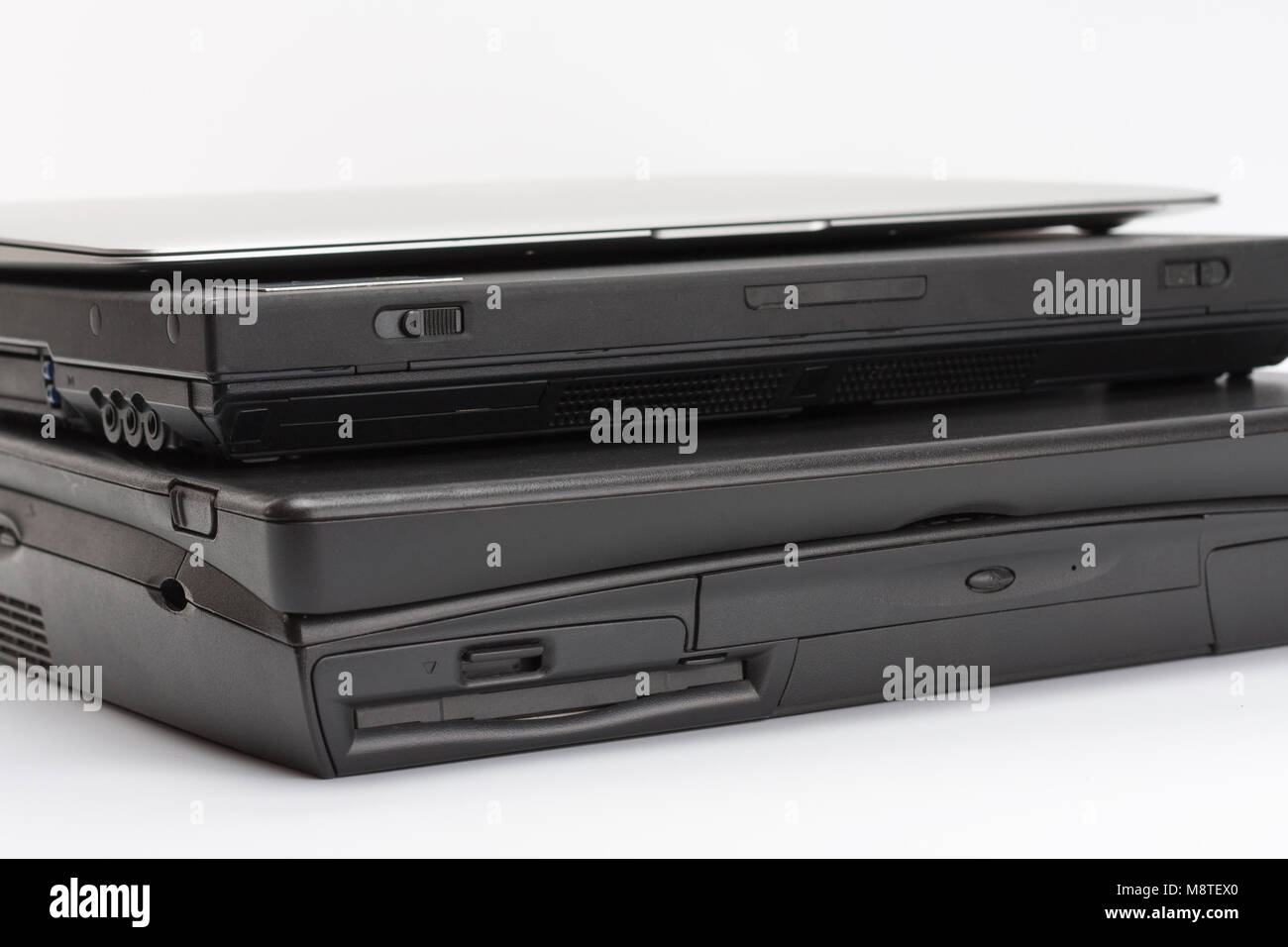 Comparing of laptops, new modern and old laptops, present and past ...