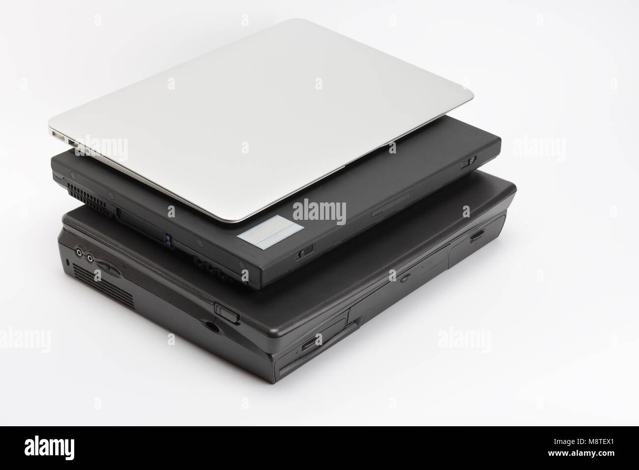 Comparing of laptops, new modern and old laptops, present and past ...