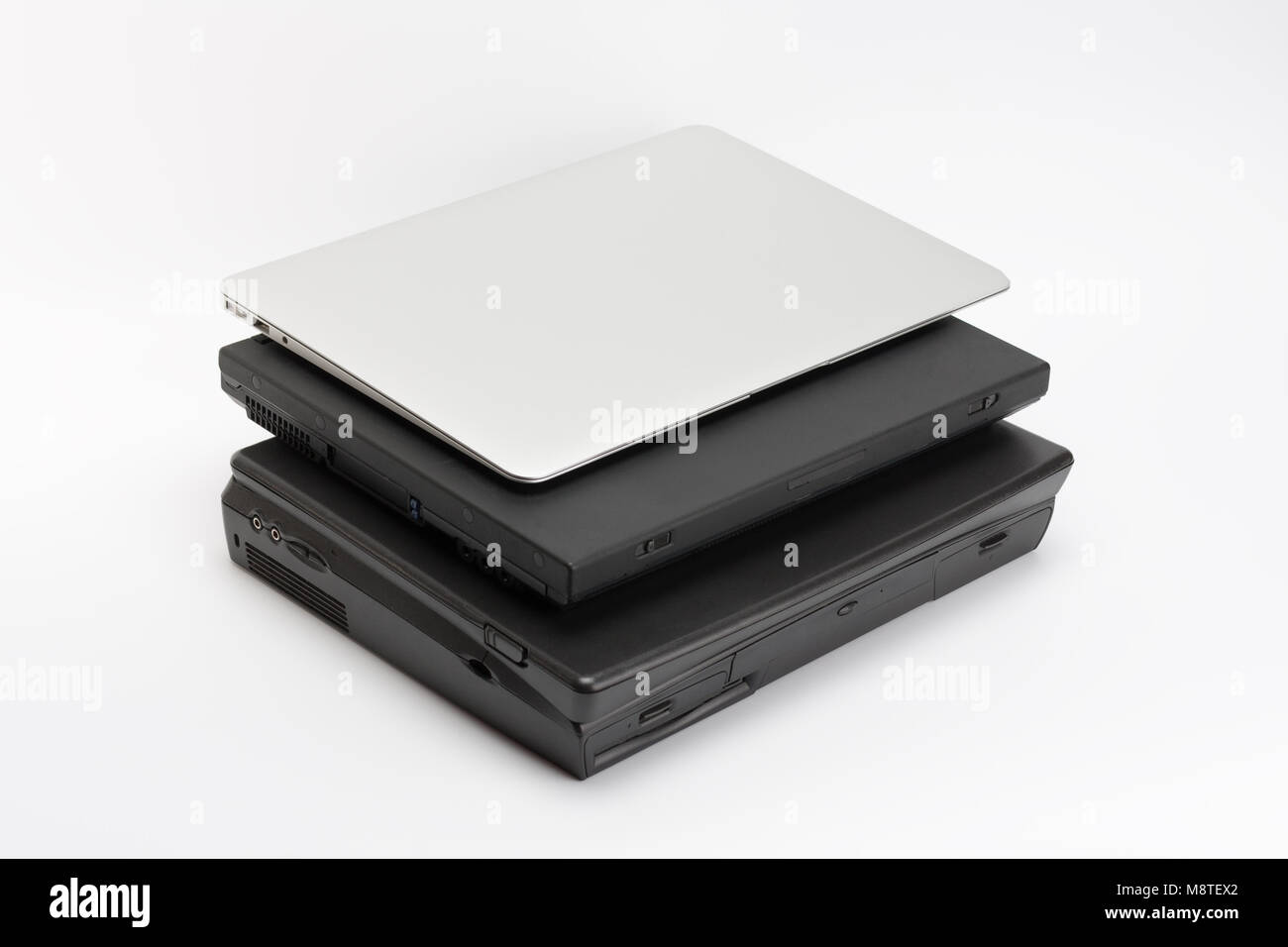 Comparing of laptops, new modern and old laptops, present and past ...