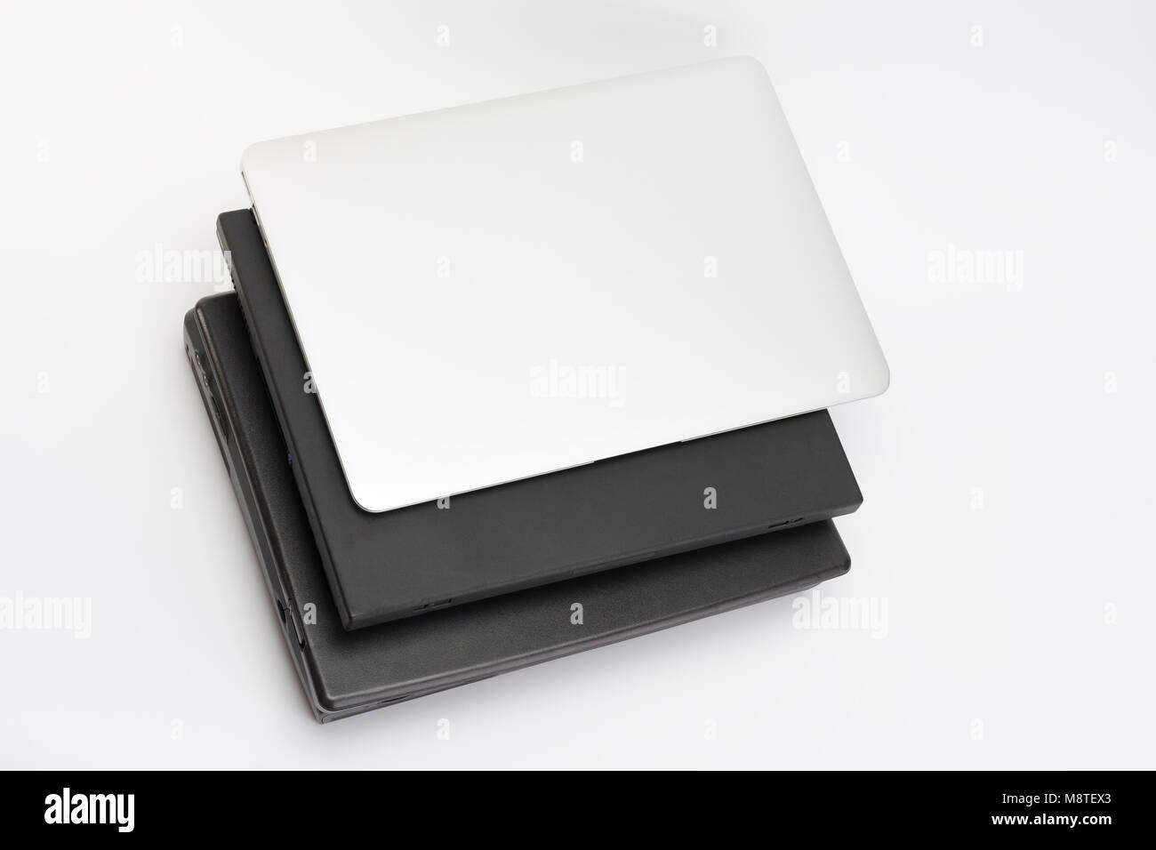 Comparing of laptops, new modern and old laptops, present and past ...