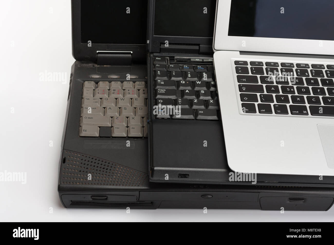 Comparing of laptops, new modern and old laptops, present and past ...