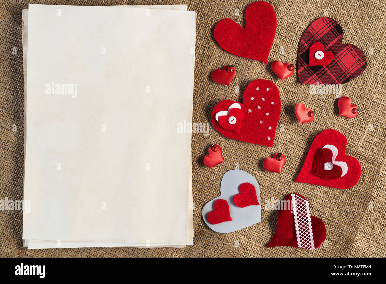 Handmade love hearts and sheets of blank paper Stock Photo - Alamy