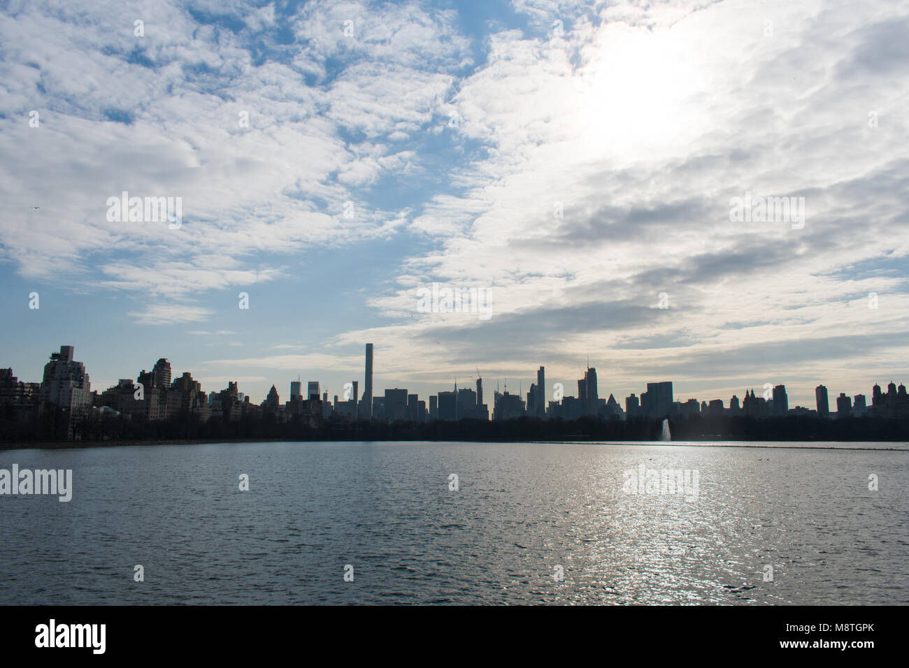 New York City skyline over a lake with awesome clouds and sky Stock ...