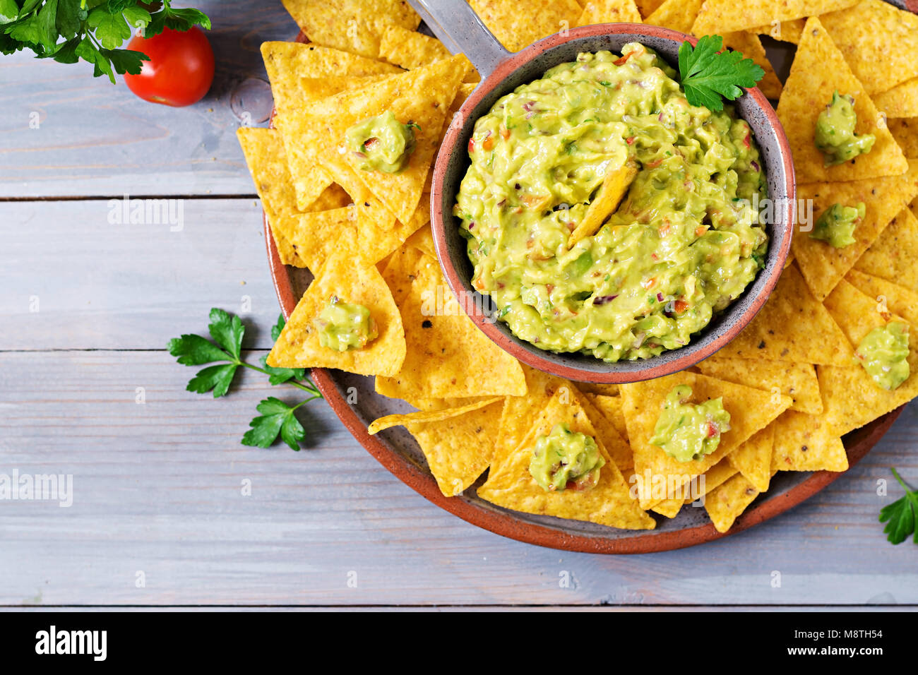 Guacamole avocado, lime, tomato, onion and cilantro, served with nachos ...