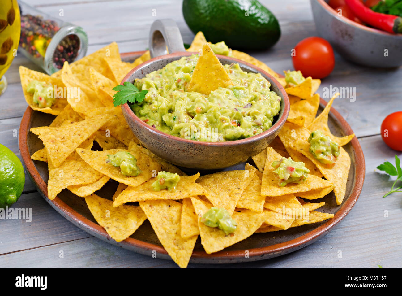 Guacamole avocado, lime, tomato, onion and cilantro, served with nachos ...