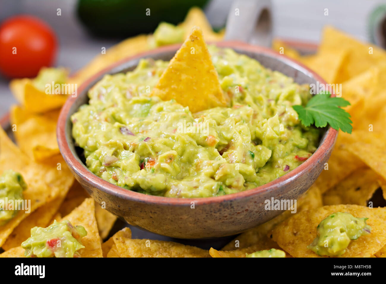 Guacamole avocado, lime, tomato, onion and cilantro, served with nachos ...