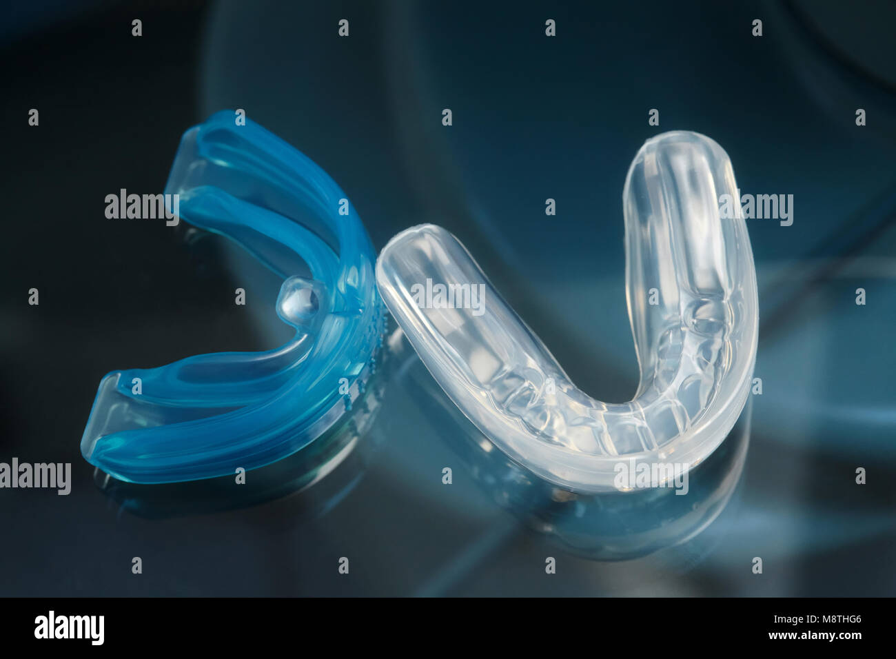 Pre-orthodontic dental trainer alignment appliance on glass background ...