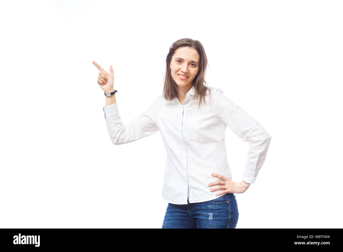 beautiful woman showing a finger at something, on a white background in ...