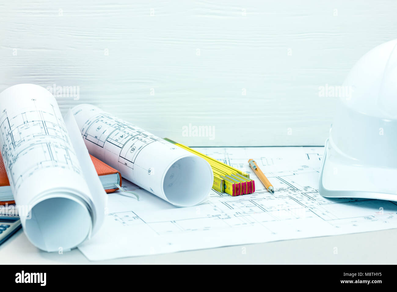 contractor workplace background. architect desk with blueprints ...