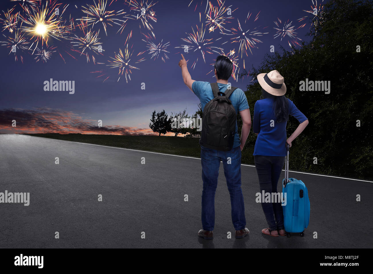 Happy asian couple tourist watching beautiful fireworks at outdoor ...