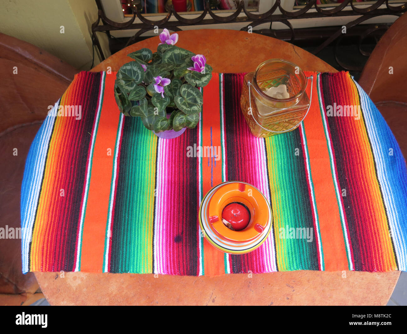 Colorful woven cloth table setting at pavement restaurant Stock Photo ...