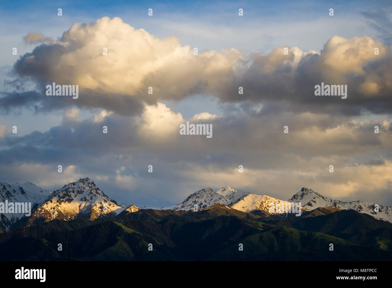 A Central Asian Landscape of Cloudy Skies and Mountains Stock Photo - Alamy