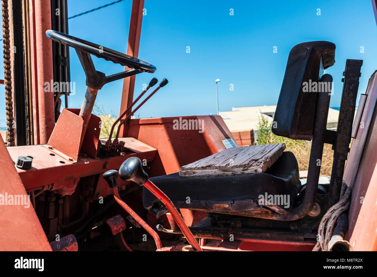 Cabin of an old forklift in a construction site in the south of Sicily ...