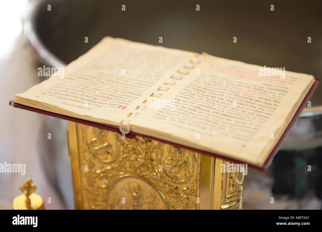 Close Up Of The New Testament At A Greek Orthodox Christening Stock close-up-of-the-new-testament-at-a-greek-orthodox-christening-stock