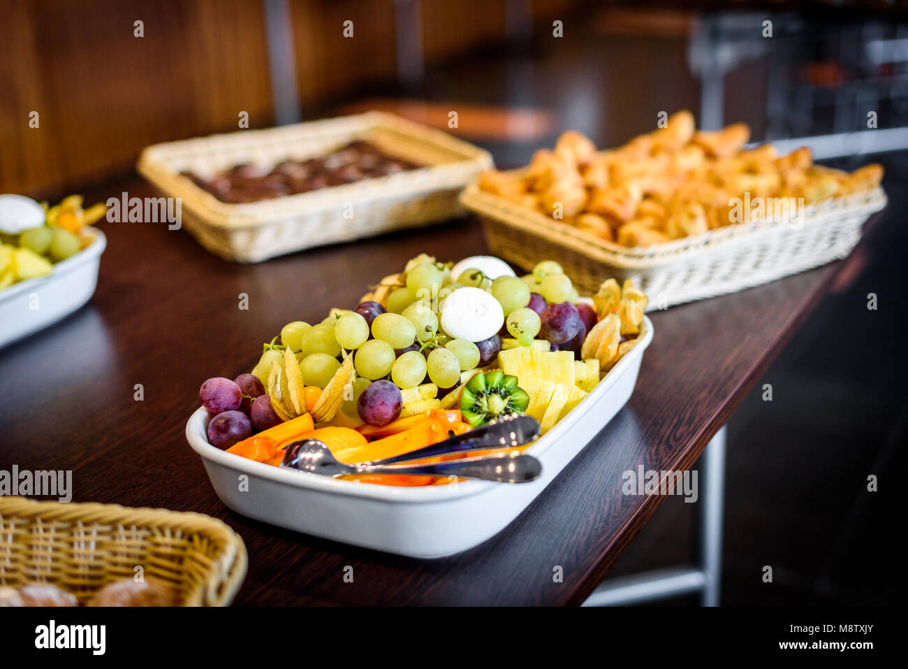 Fruit platter bowl buffet at business or wedding event venue. Self ...