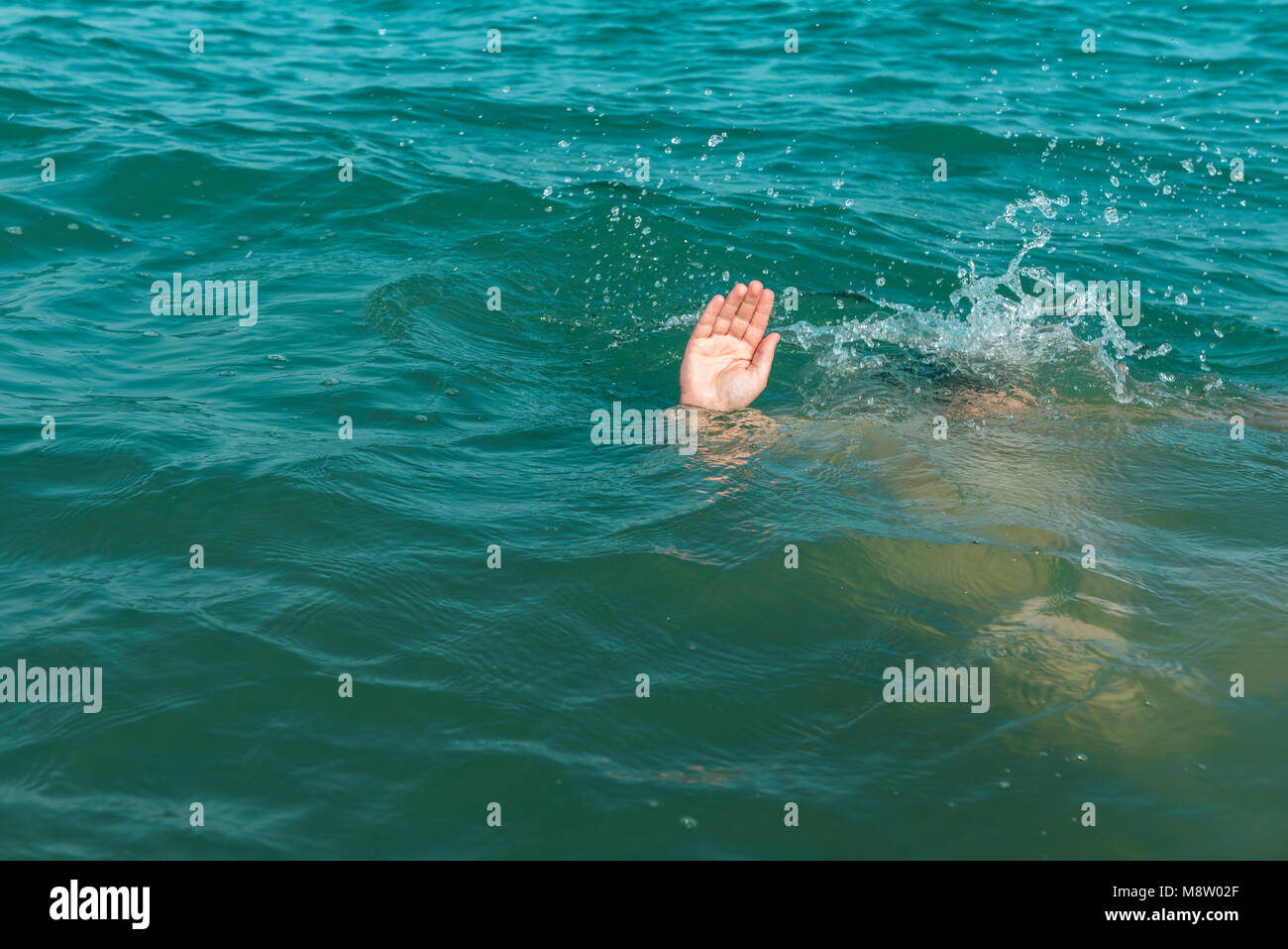 A sinking person, the salvation of a drowning man Stock Photo - Alamy