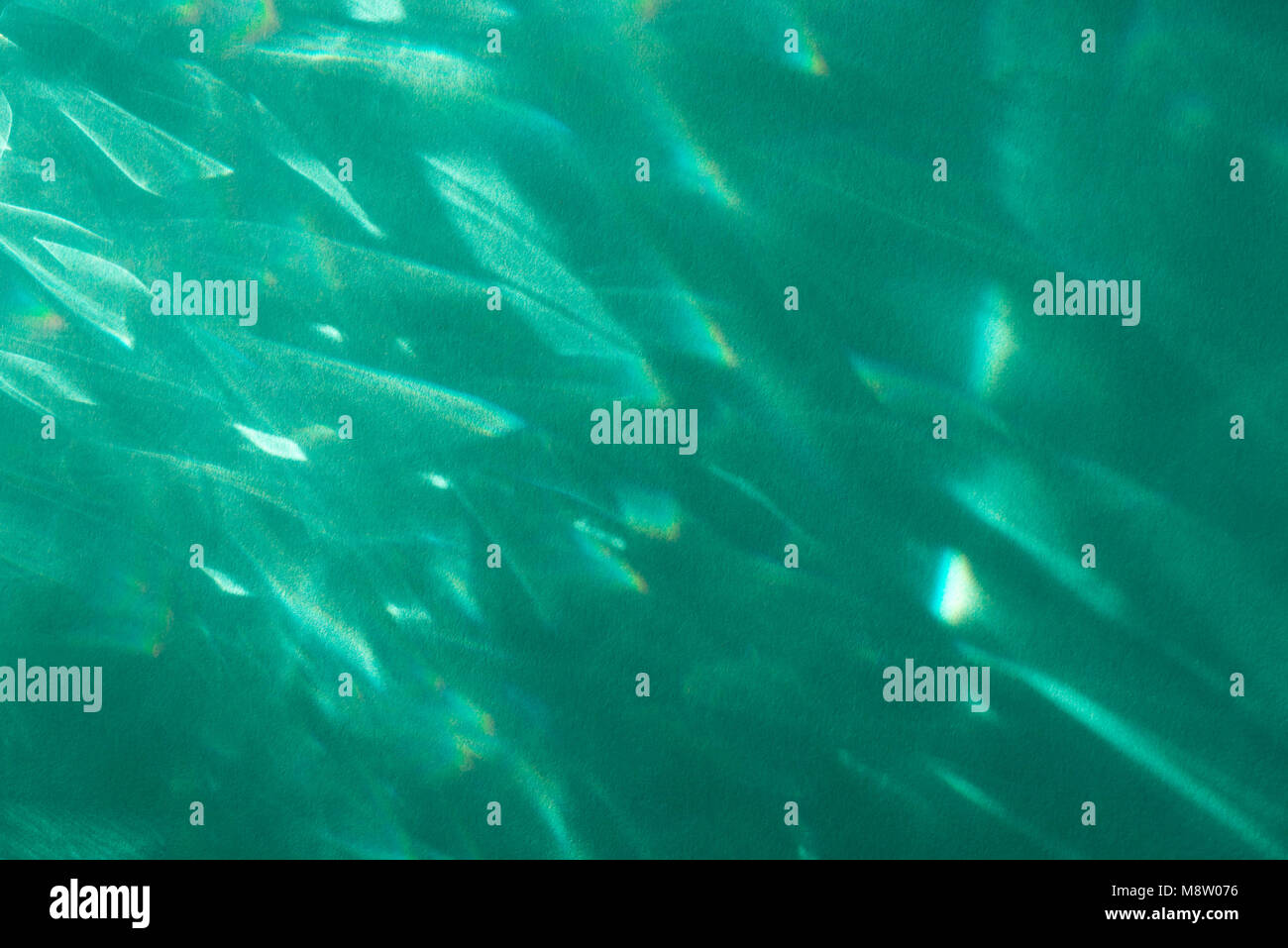 light glints on turquoise color paper background texture Stock Photo ...