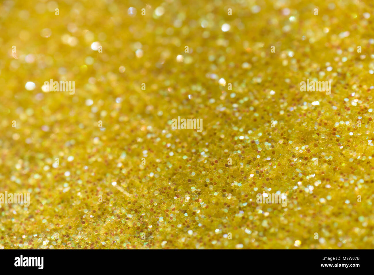 blurred gold color glittering background texture Stock Photo - Alamy