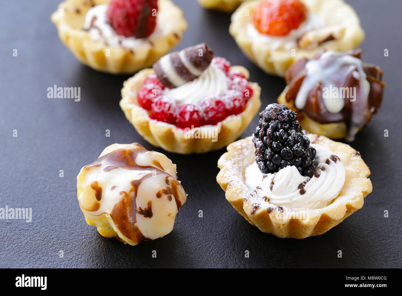 Mini dessert tarts sweet pastries for the holiday Stock Photo - Alamy