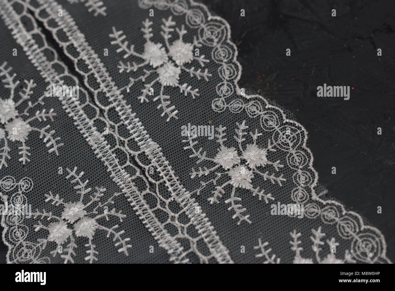 White Lace Embroidered Border on Dark Surface. Lace Texture Background ...