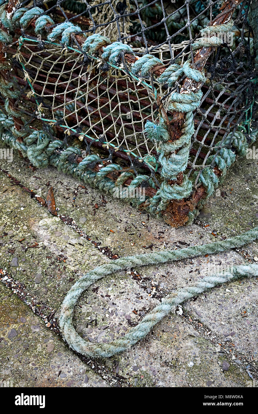 Old worn out lobster pot and rope Stock Photo - Alamy