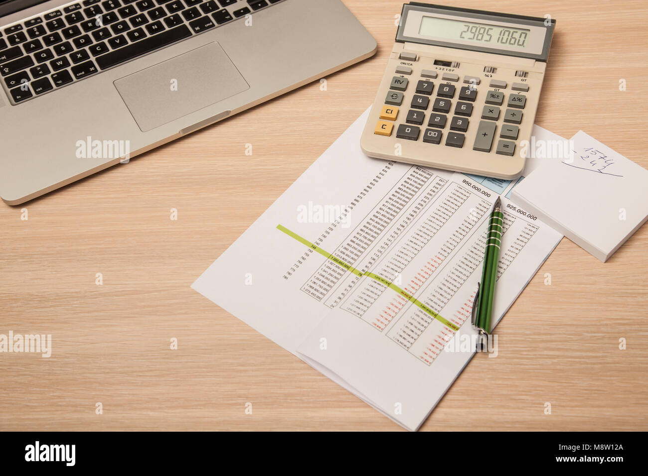 view of the office desk, calculations and notes, an accounting job ...