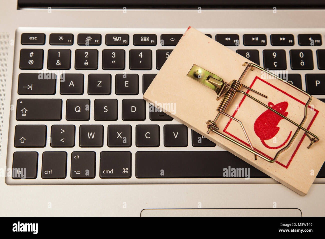 Conceptual photo, a trap set on your computer as a risk of using the ...
