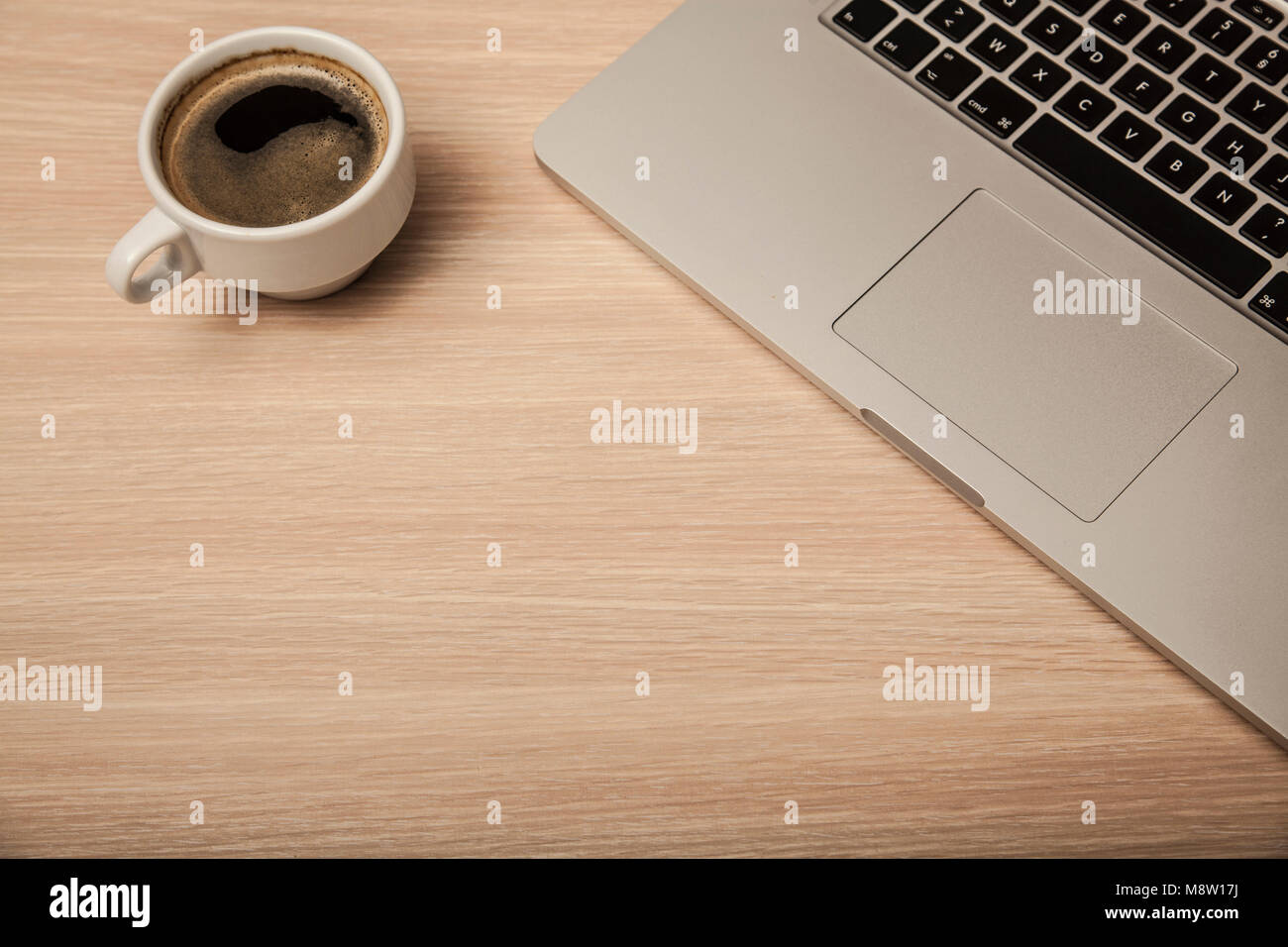 cup of coffee and a computer on the office desk Stock Photo - Alamy