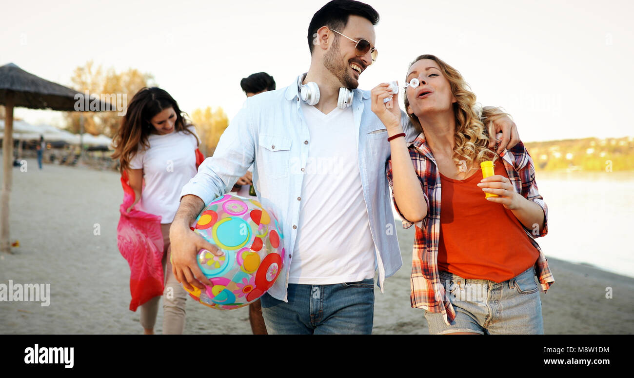 Group of young cheerful people bonding to each other and smiling Stock ...
