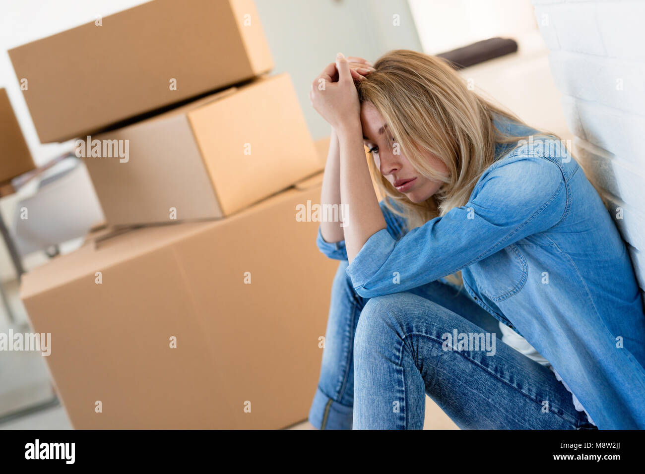 Tired woman exhausted while moving into new home Stock Photo - Alamy