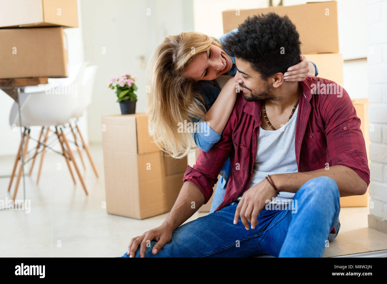 Happy couple after moving in Stock Photo - Alamy