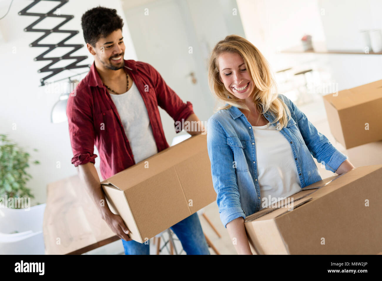 home, people, moving and real estate concept - happy couple having fun ...