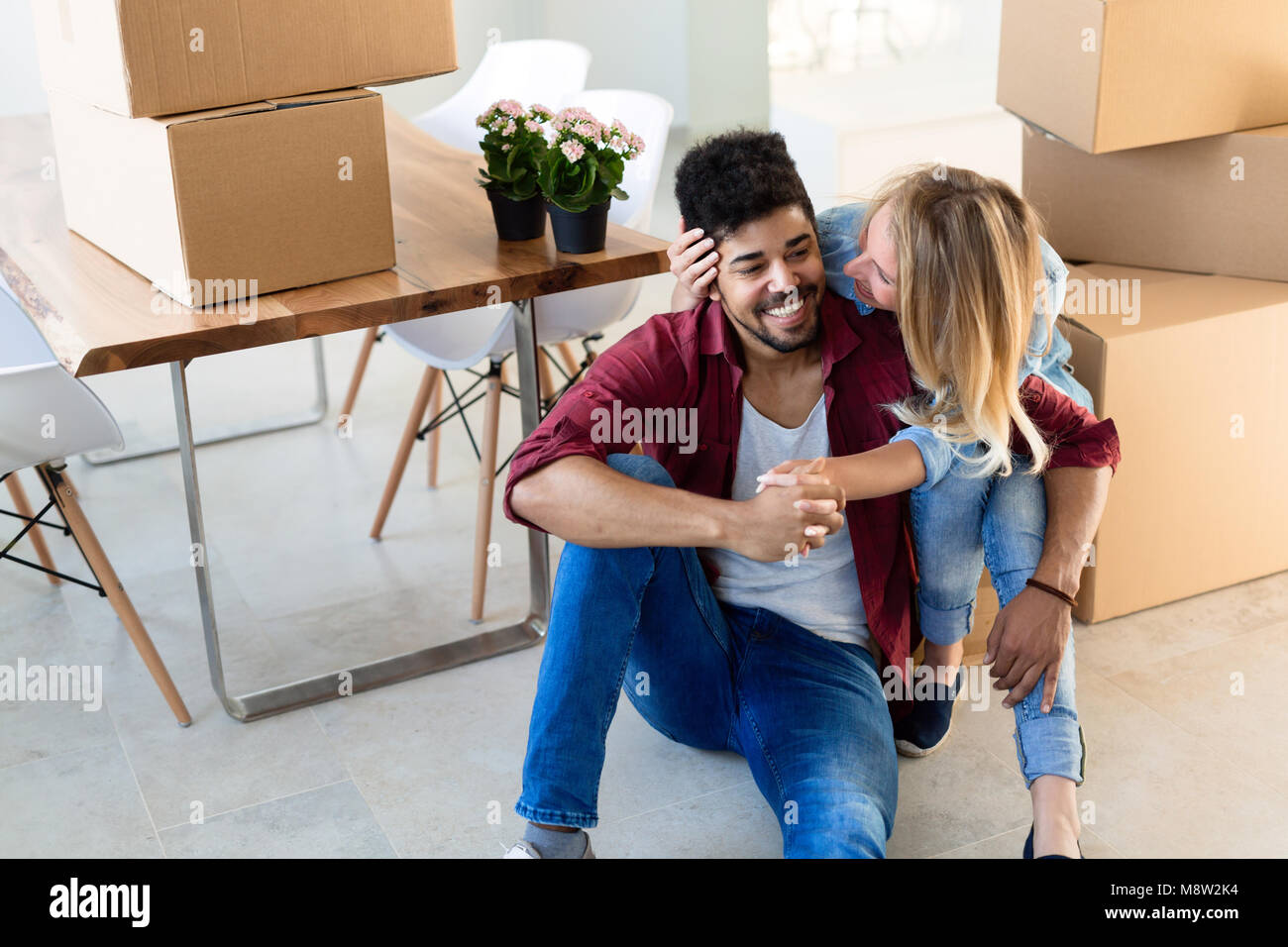 home, people, moving and real estate concept - happy couple having fun ...