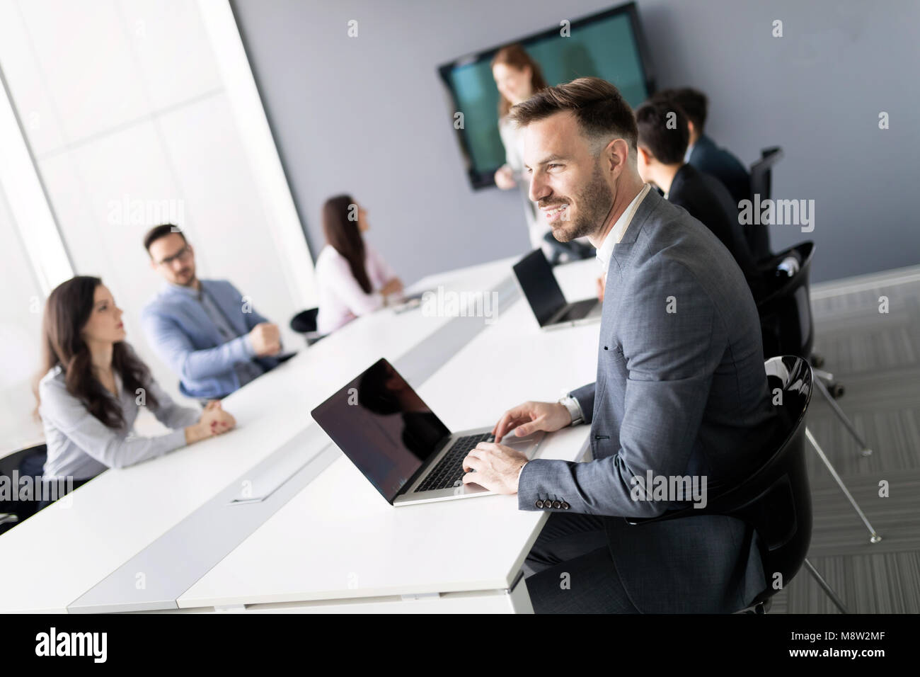 Group of business people collaborating in office Stock Photo - Alamy