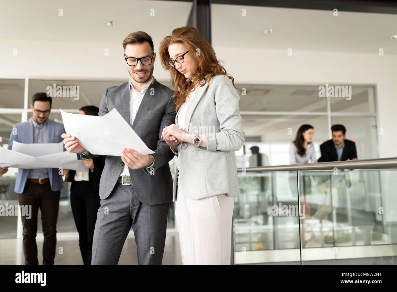 Group of business people collaborating in office Stock Photo - Alamy