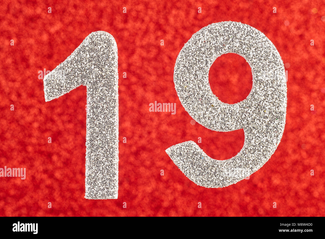 Number nineteen silver color over a red background. Anniversary ...