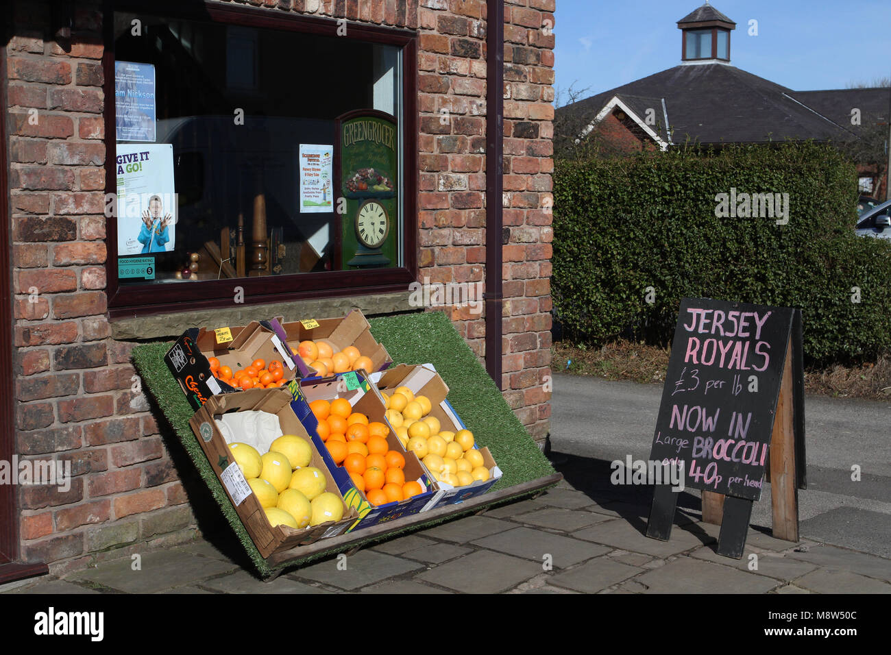 Fresh fruit and vegetables on display outside a roadside greengrocers ...
