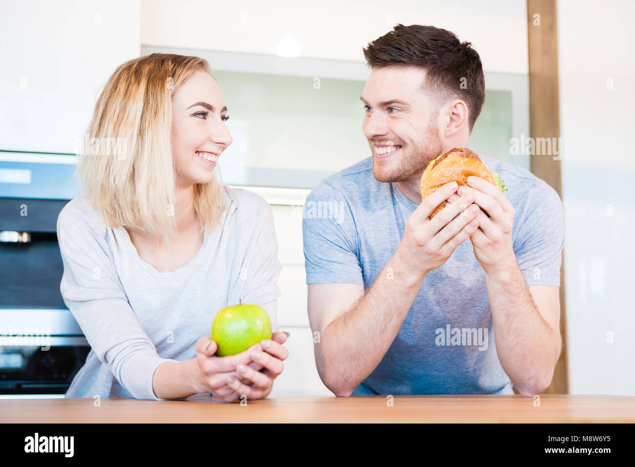 couple eating food Stock Photo - Alamy