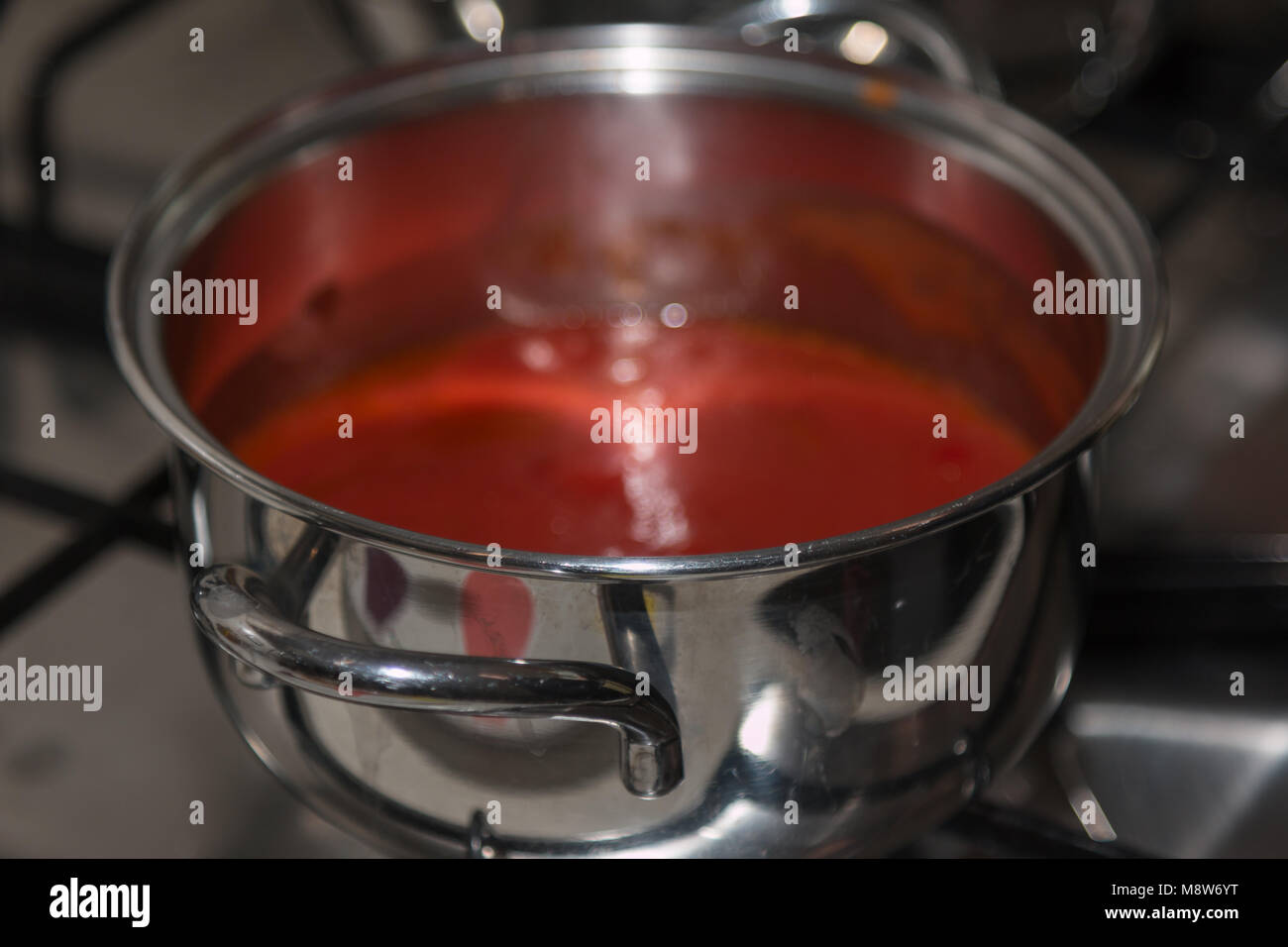 Metallic Pot with Italian Style Tomato Sauce Stock Photo - Alamy